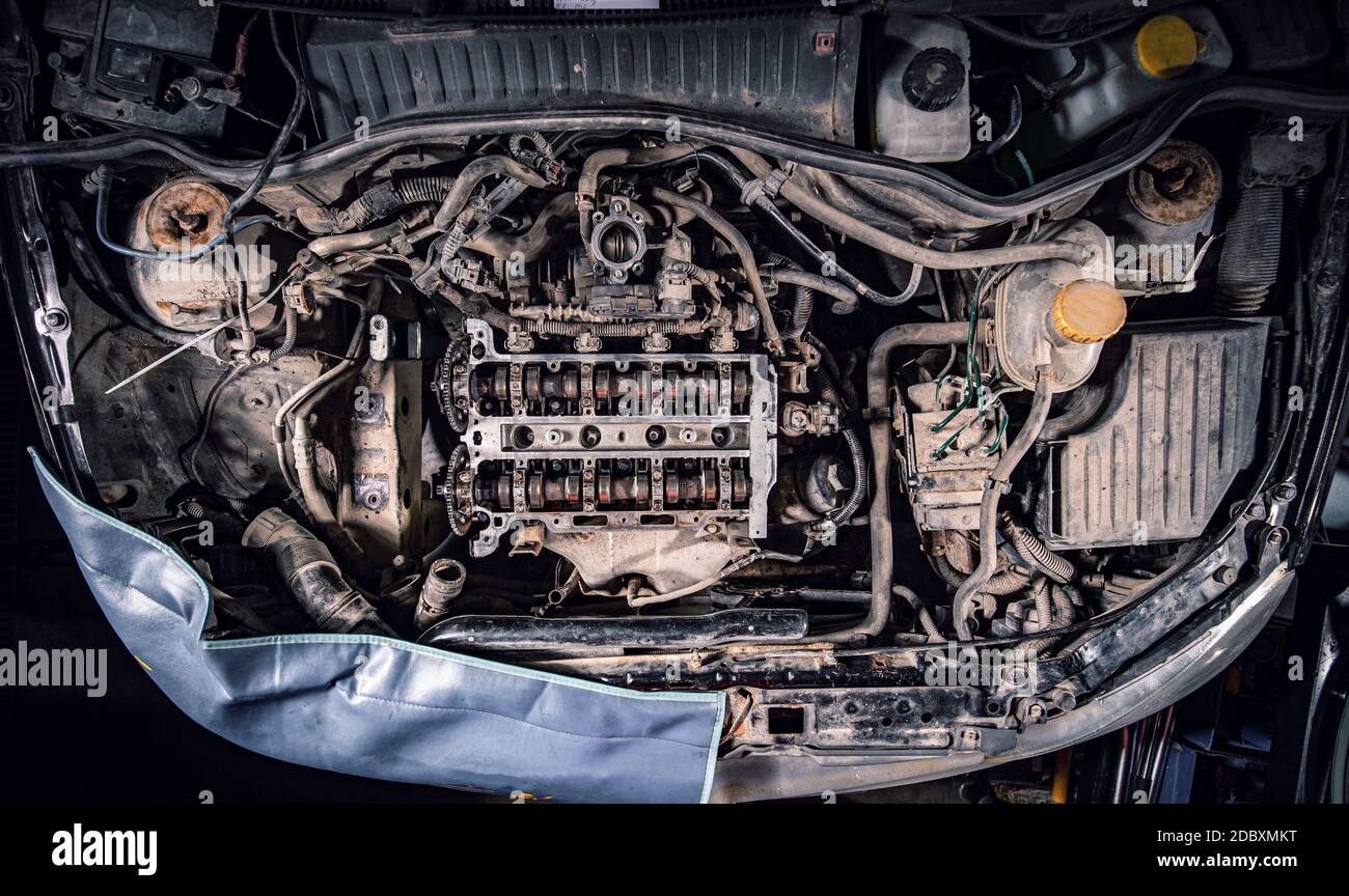 Top view of used engine and auto parts. Bad car maintenance concept ...