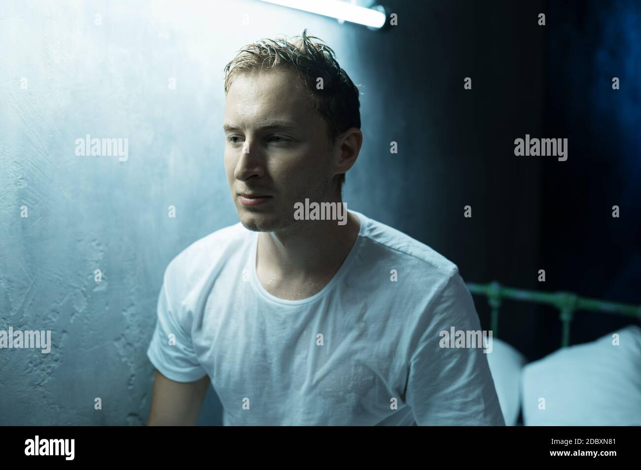 Portrait of psycho man with tired face, insomnia, disorder, dark room ...