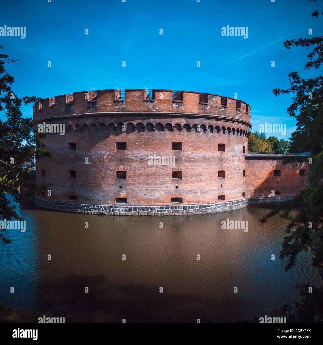 An old red brick fortress on the beach . Historical antique world ...