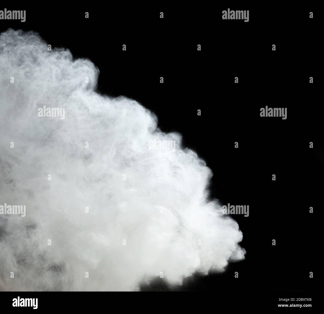 cloud of white wheat flour on a black background, particles fly in ...