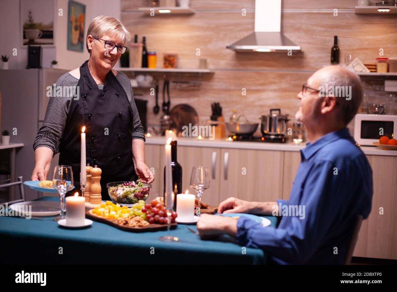 Senior couple celebration relationship having a romantic dinner in ...
