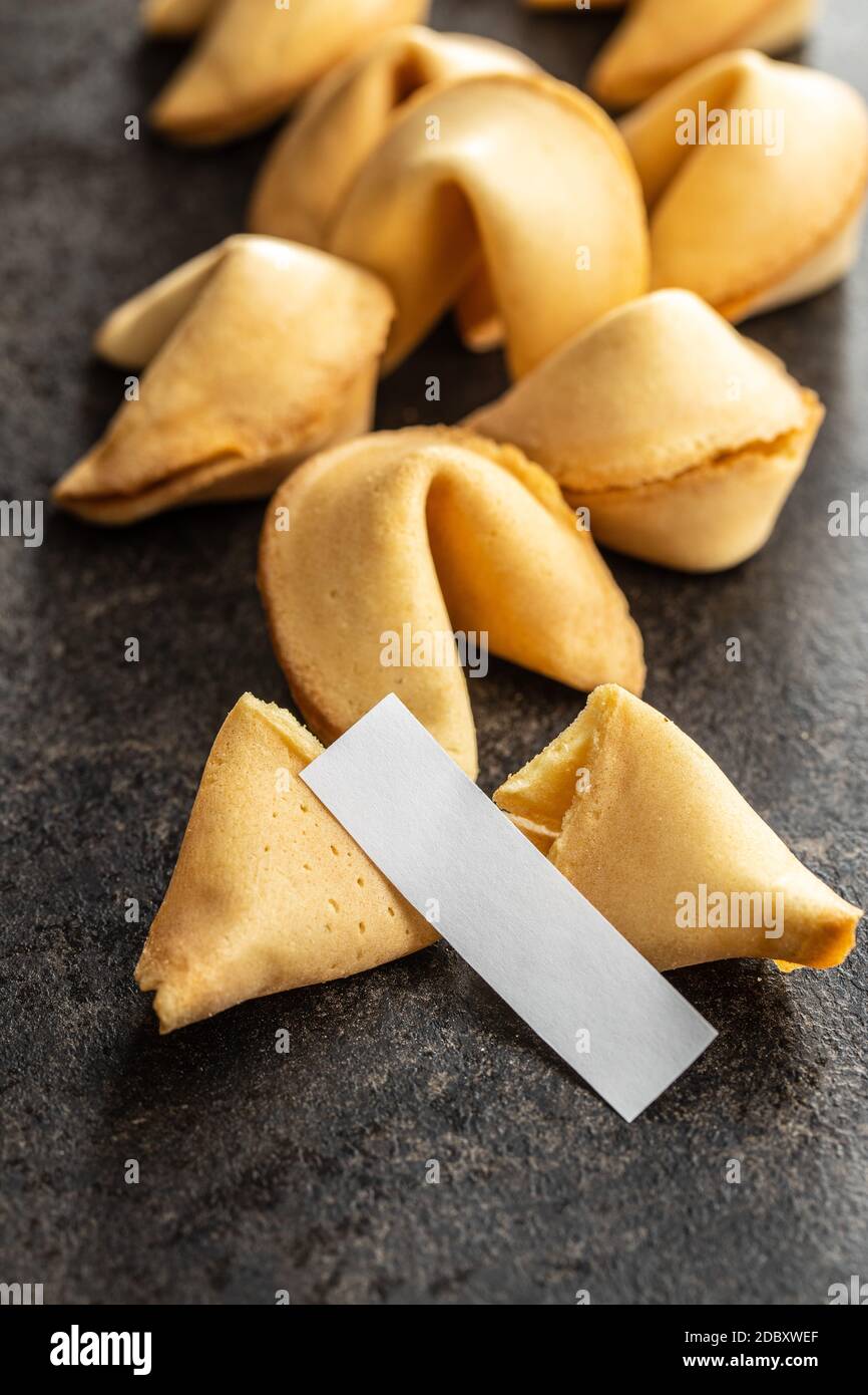 Chinese lucky cookies. Fortune cookies on black table Stock Photo - Alamy
