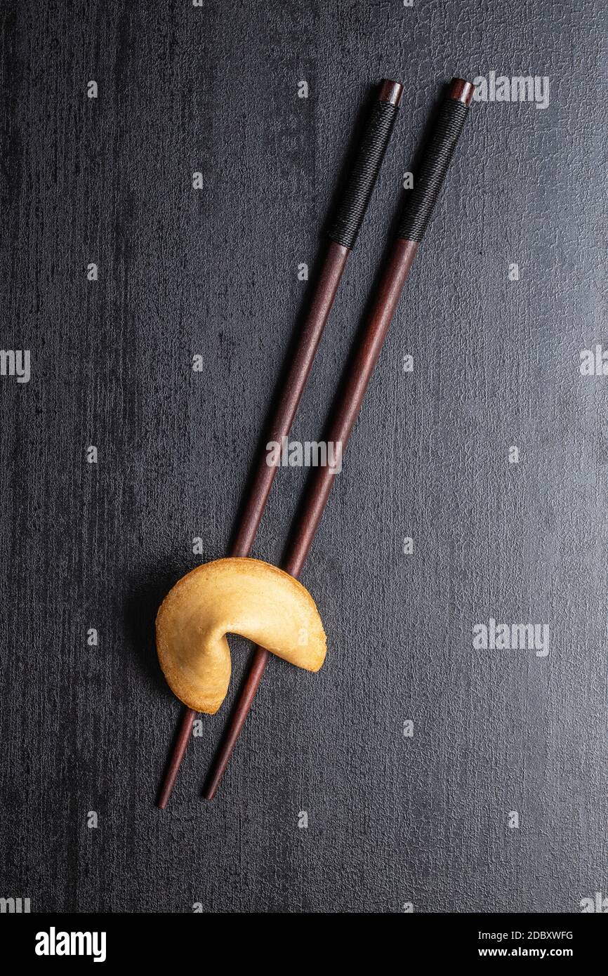 Chinese lucky cookies. Fortune cookies on chopsticks. Top view Stock ...