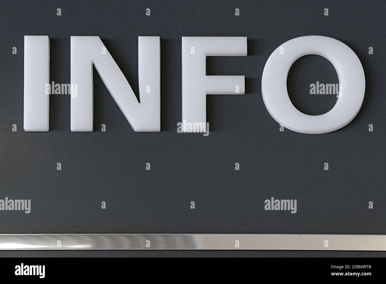 White 3d plastic letters info at wall Stock Photo - Alamy