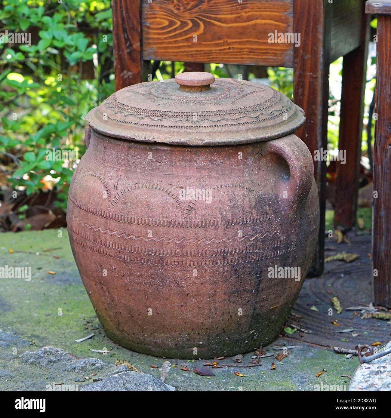 Big terracotta cooking pot with lid Stock Photo - Alamy