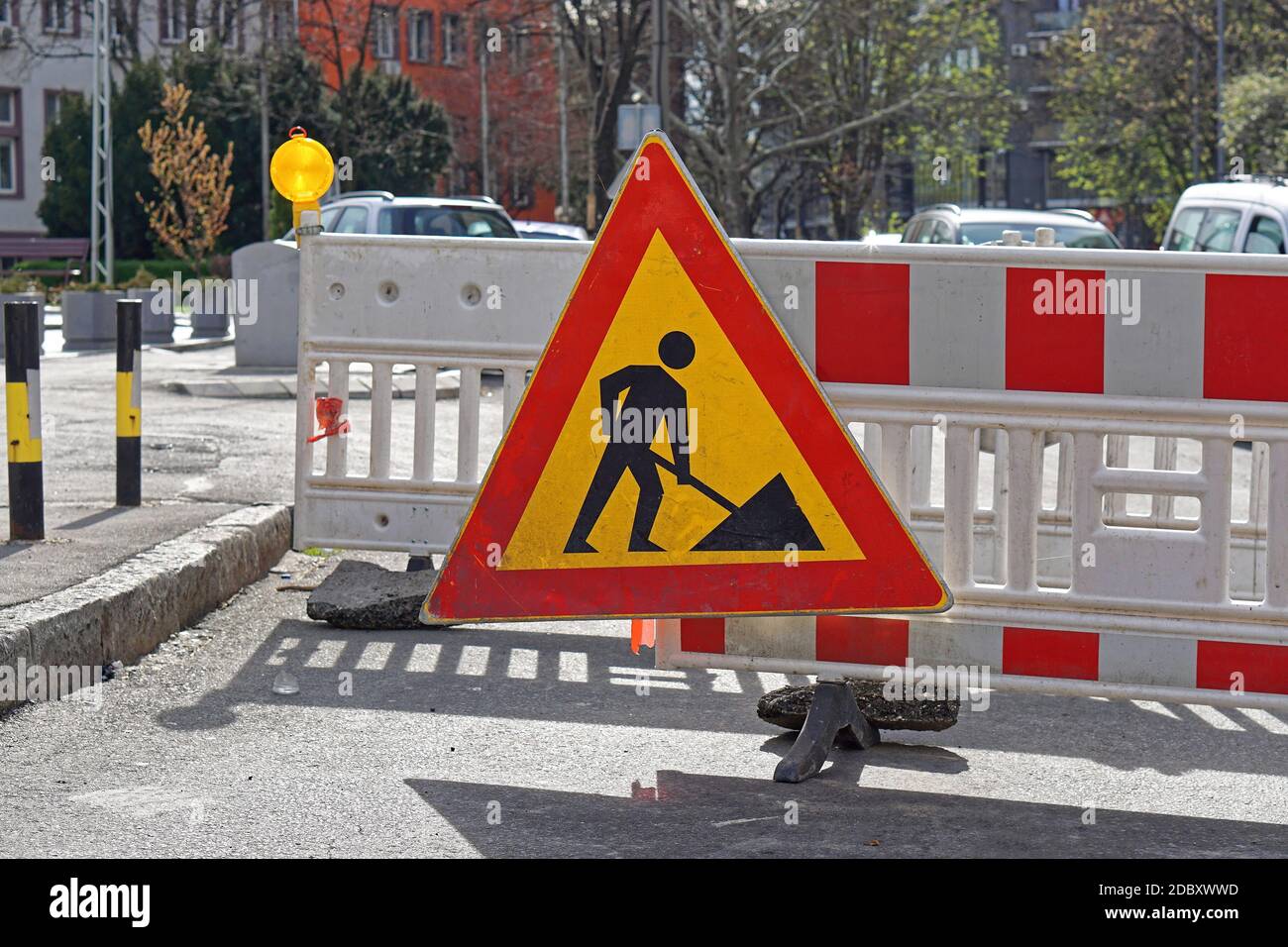 Road work traffic sign and construction arrier Stock Photo - Alamy
