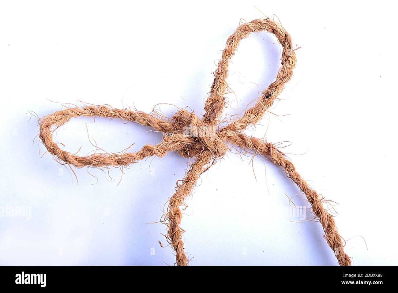 Brown rope isolated over white background Stock Photo - Alamy