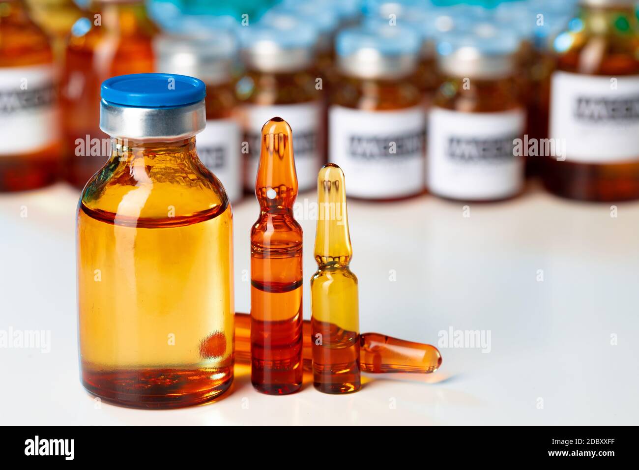Pile of glass medical vials with medication on lab table Stock Photo ...