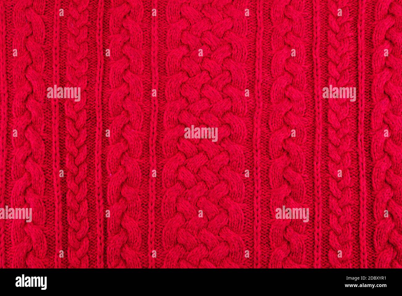 A background texture red knitting cable rib pattern Stock Photo - Alamy