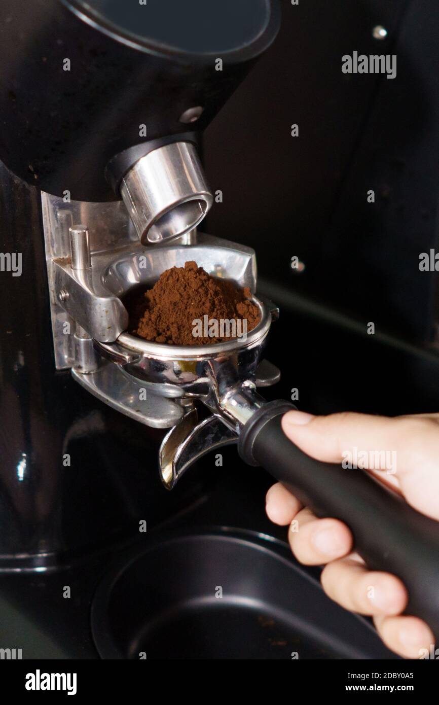 coffee powder from grinder on portafilter Stock Photo - Alamy