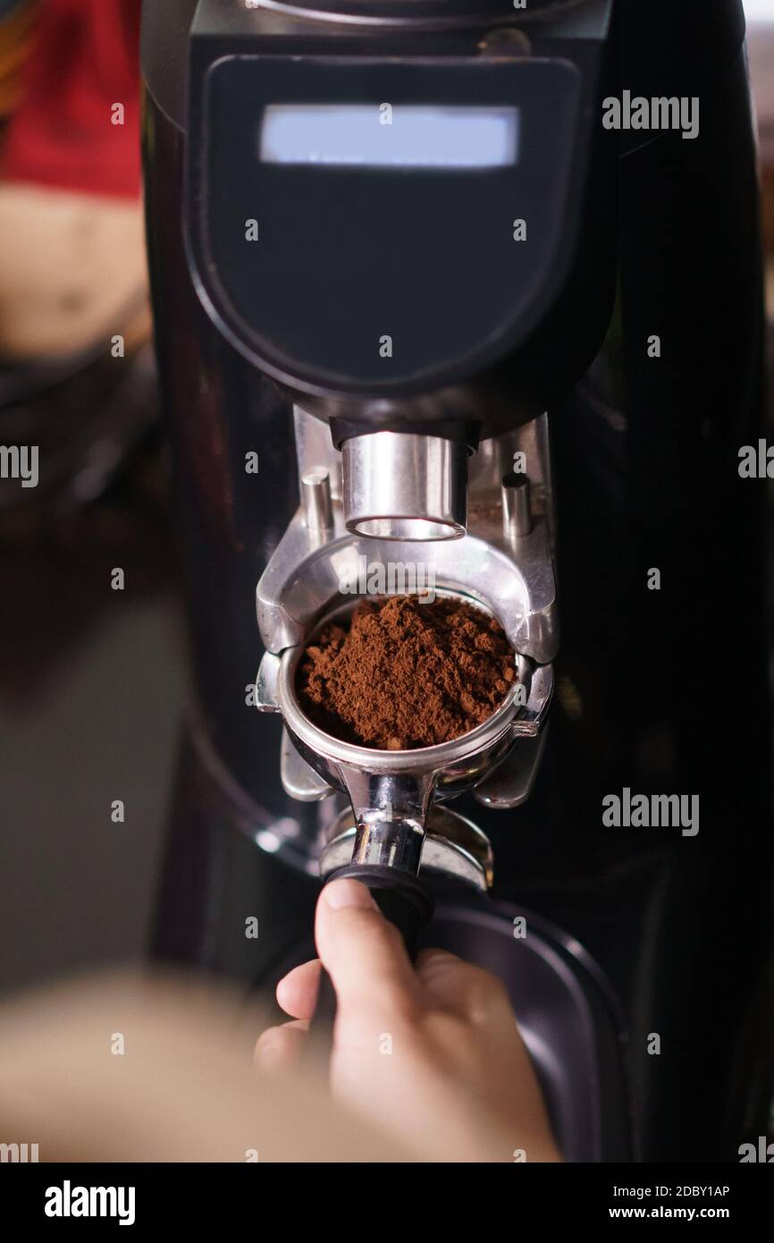 coffee powder from grinder on portafilter Stock Photo - Alamy