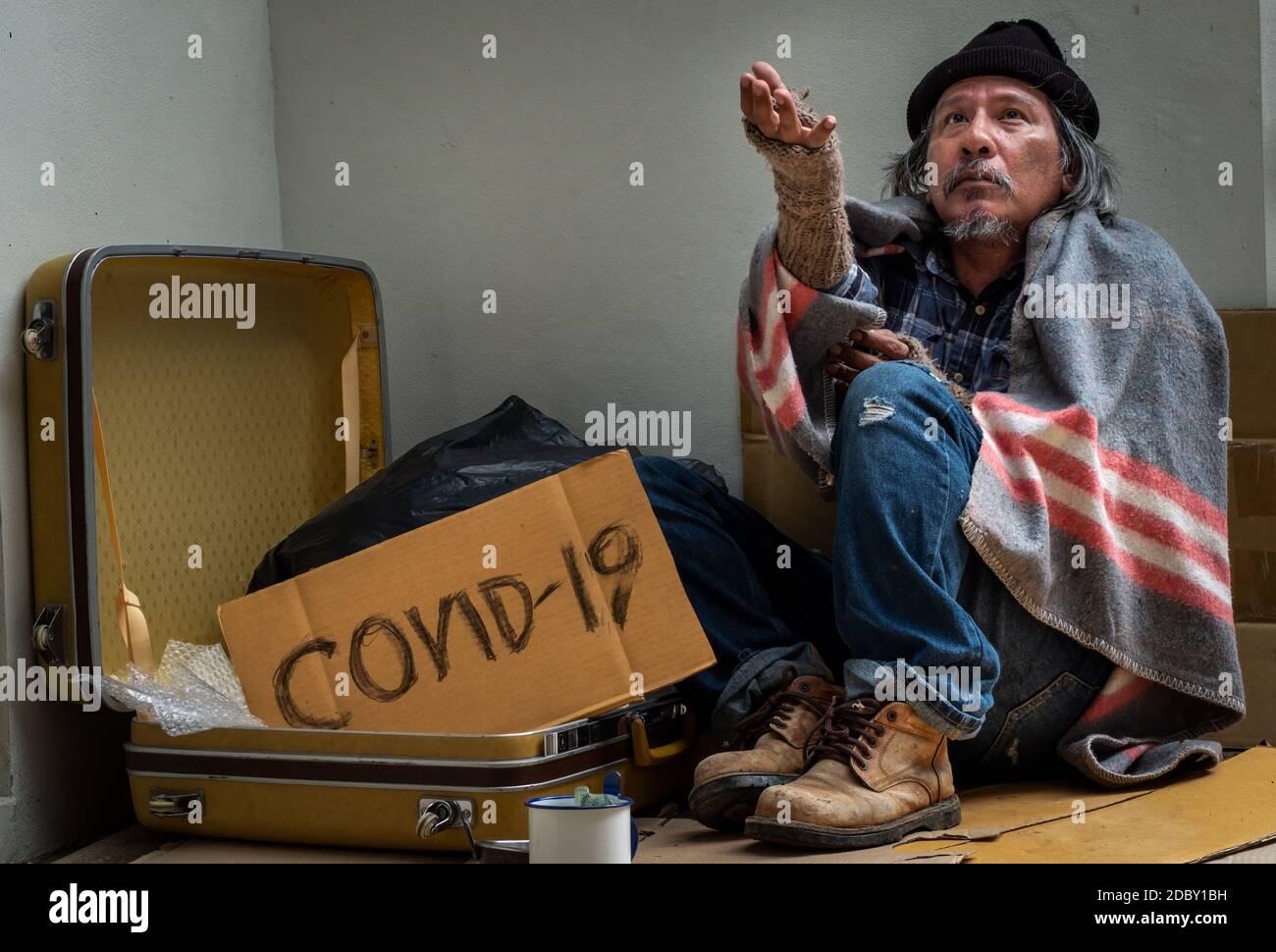 Homeless man laying sidewalk hi-res stock photography and images - Alamy