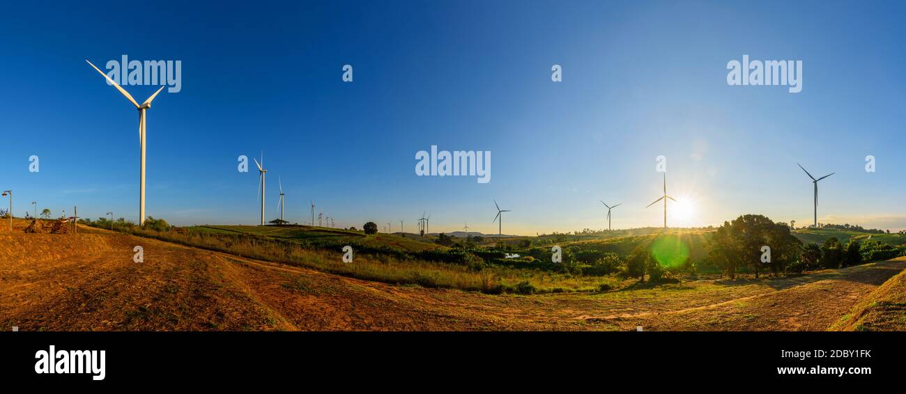 wind turbines park for make the electric power from wind in sunset time ...