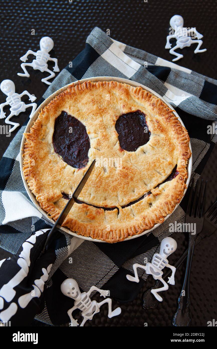 Homemade cherry pie with a scary face for Halloween Stock Photo - Alamy
