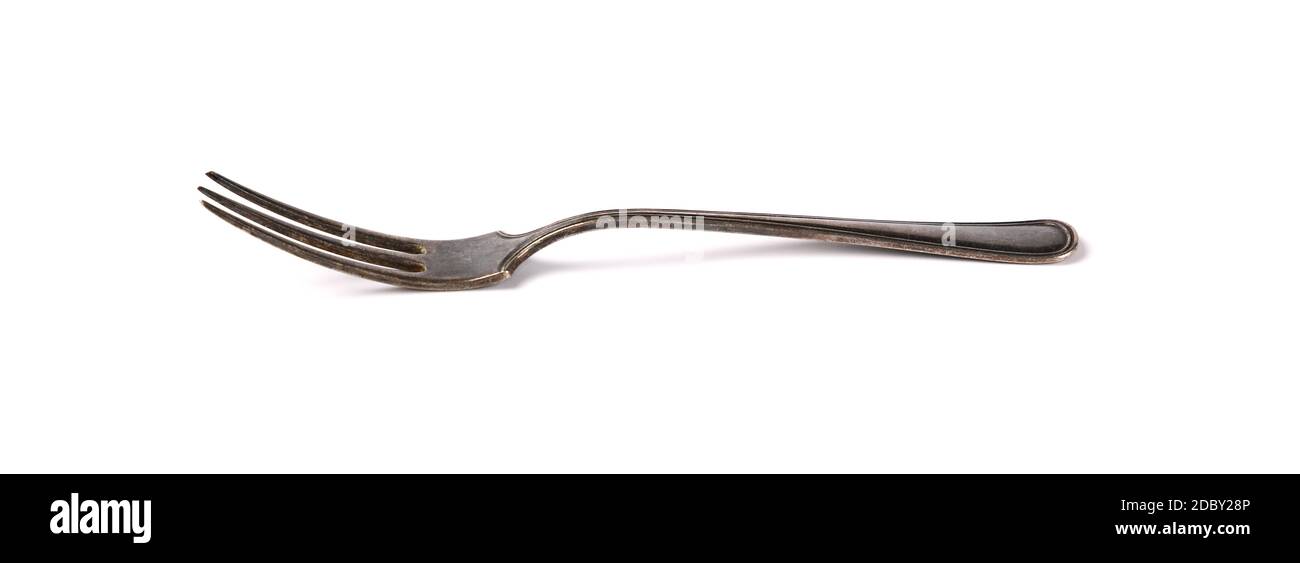 Close up one old vintage metal fork isolated on white background, low ...
