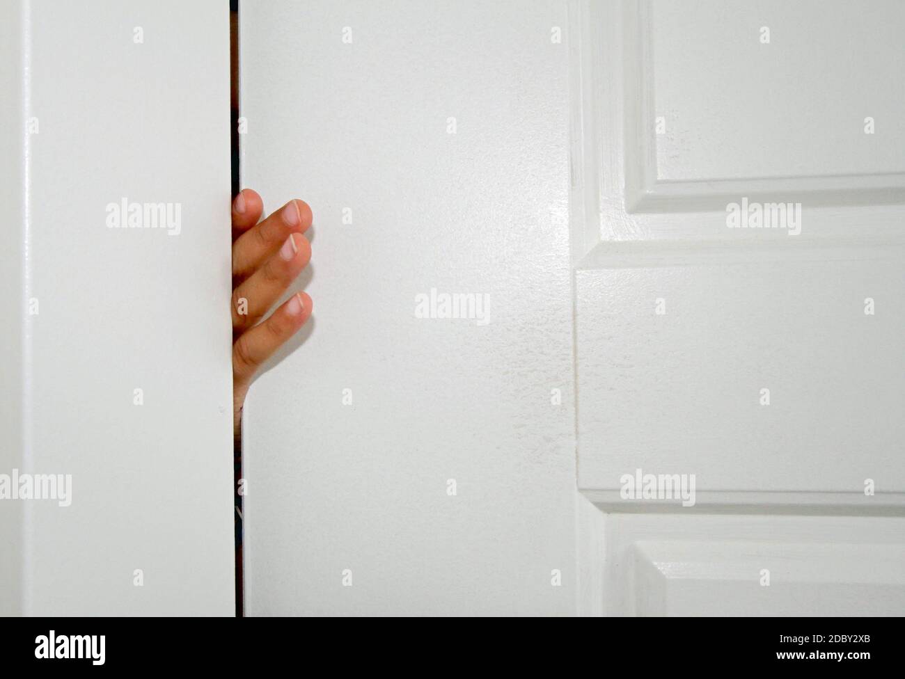 Small fingers stuck in door of house Stock Photo - Alamy