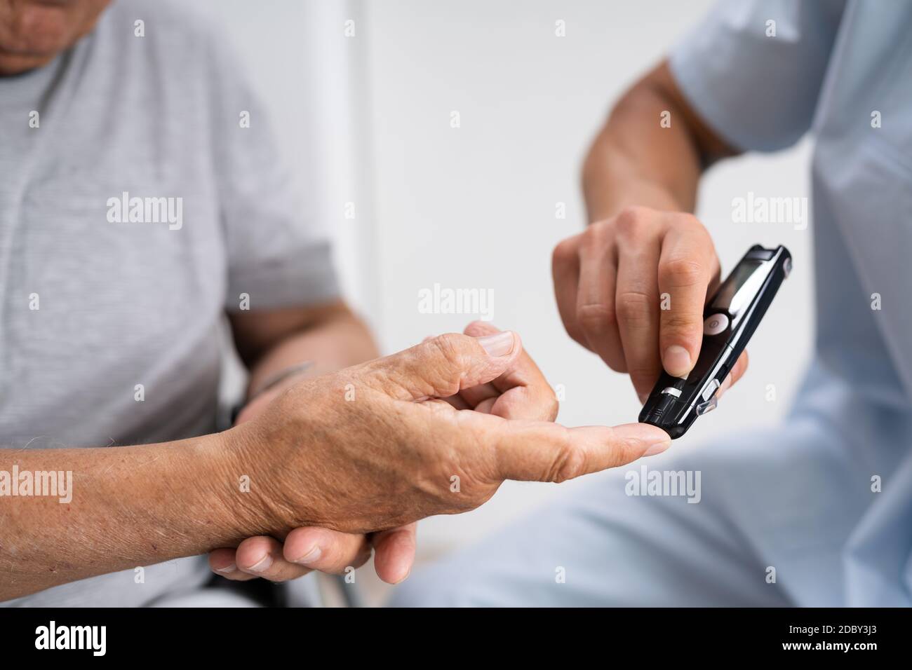 Blood Sugar Diabetes Healthcare Check For Old Man Stock Photo - Alamy
