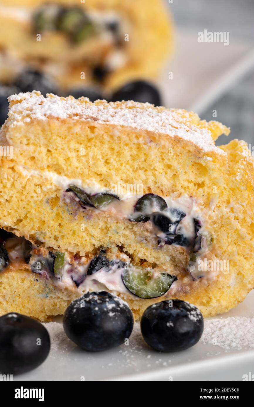 sponge roulade cake with blueberry Stock Photo - Alamy