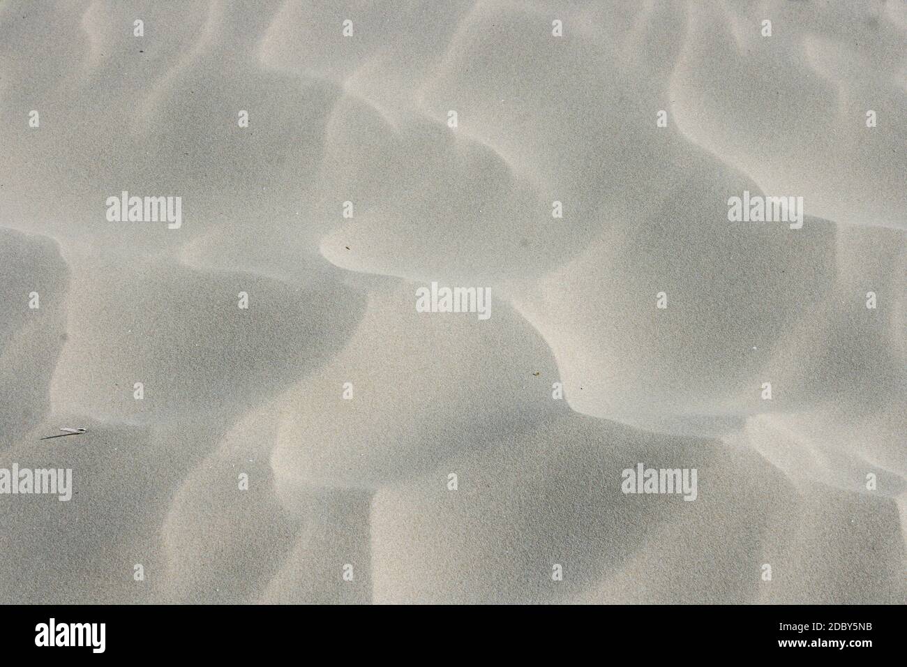a wavy pattern in beige sand Stock Photo - Alamy