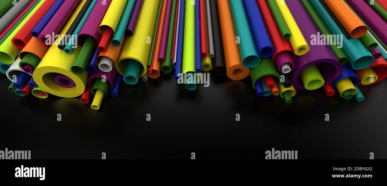 Colorful Plastic pipes on dark background Stock Photo - Alamy