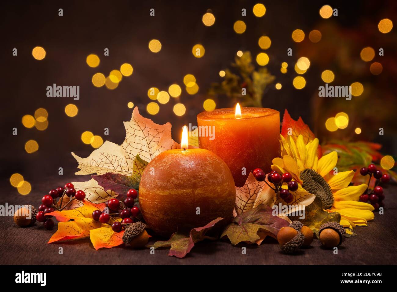 Autumn arrangement of candles, autumn leaves and sunflowers Stock Photo ...
