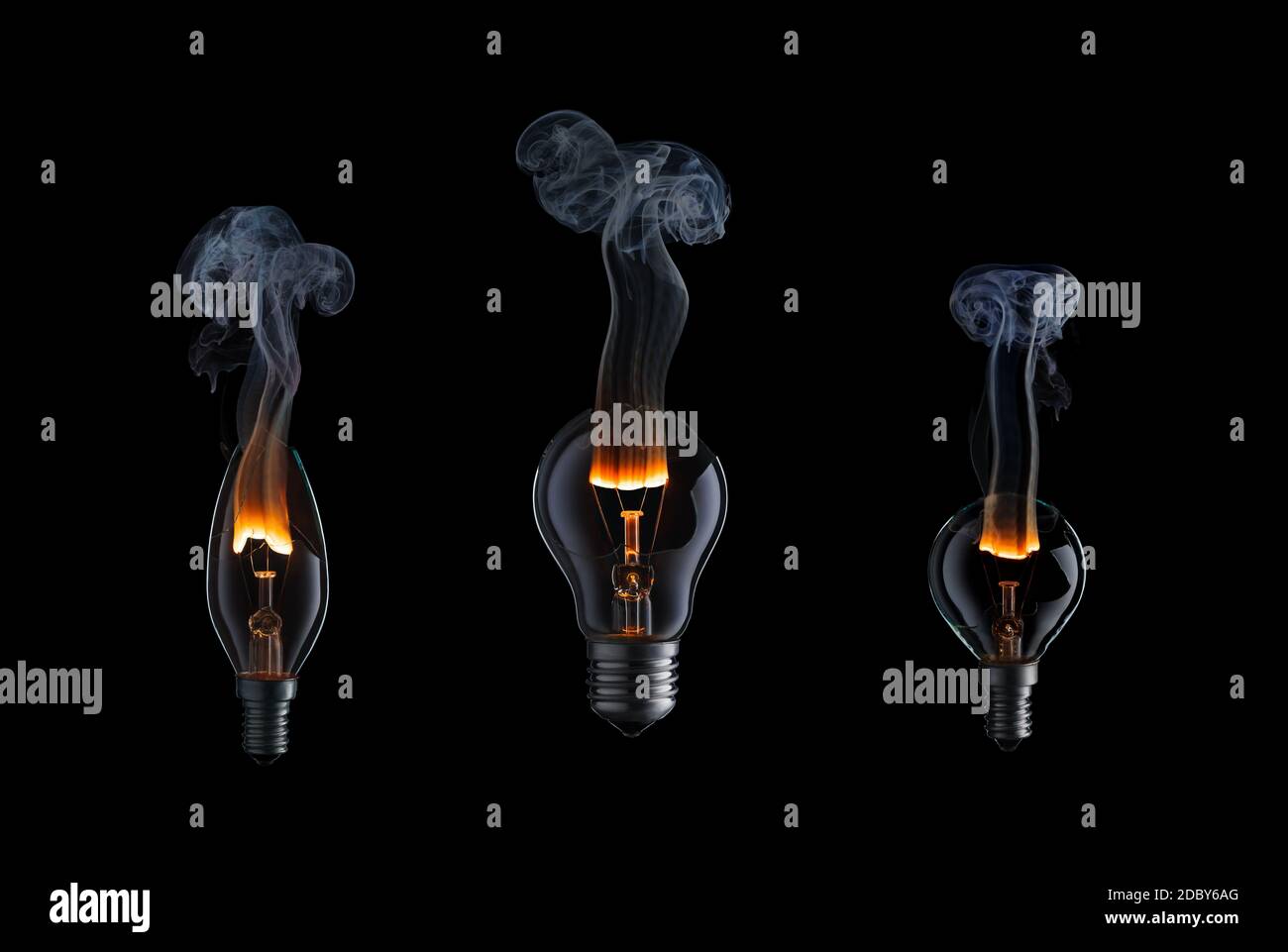 Collection of light bulbs with fire and smoke on black background Stock ...
