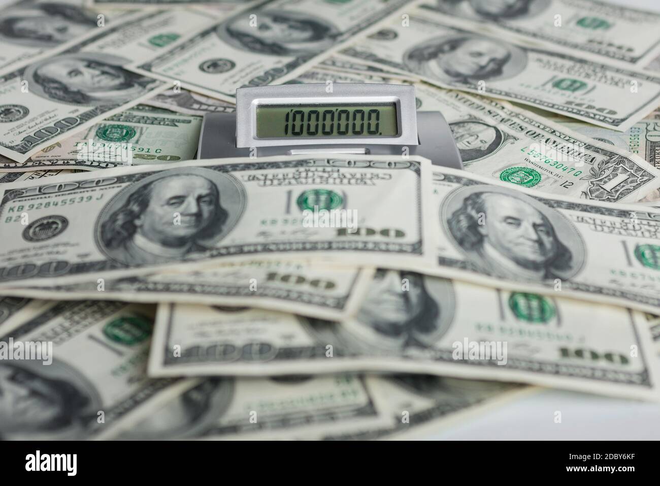 Background of $ 100 bills and a calculator can be used as background ...