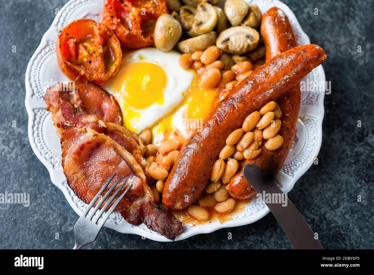 close up of plate of rustic full english breakfast Stock Photo - Alamy