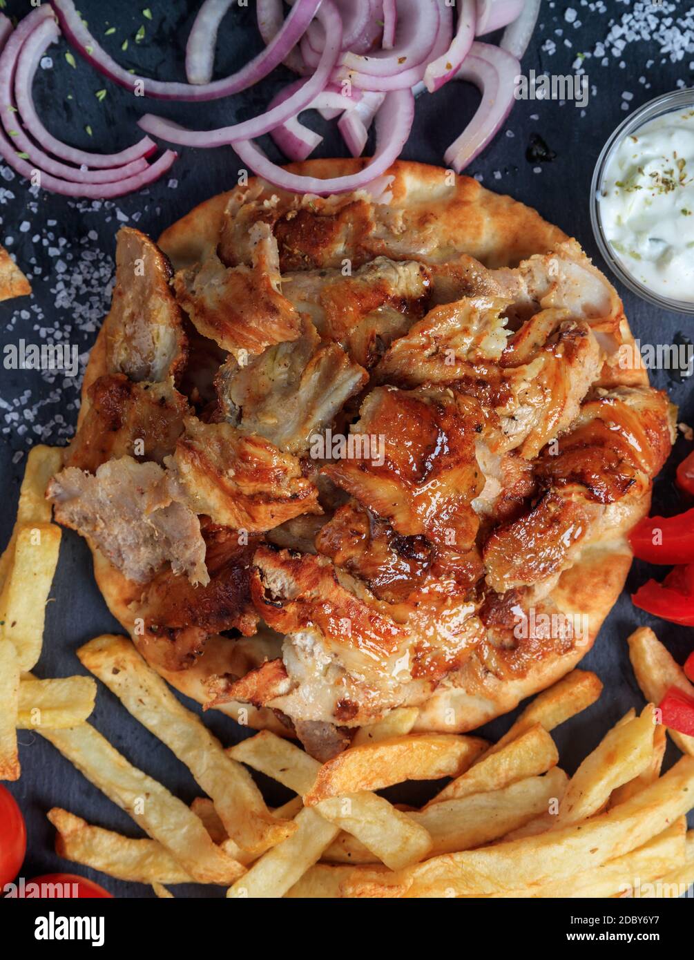 Gyros greek food. Grilled meat slices served with fried potatoes ...