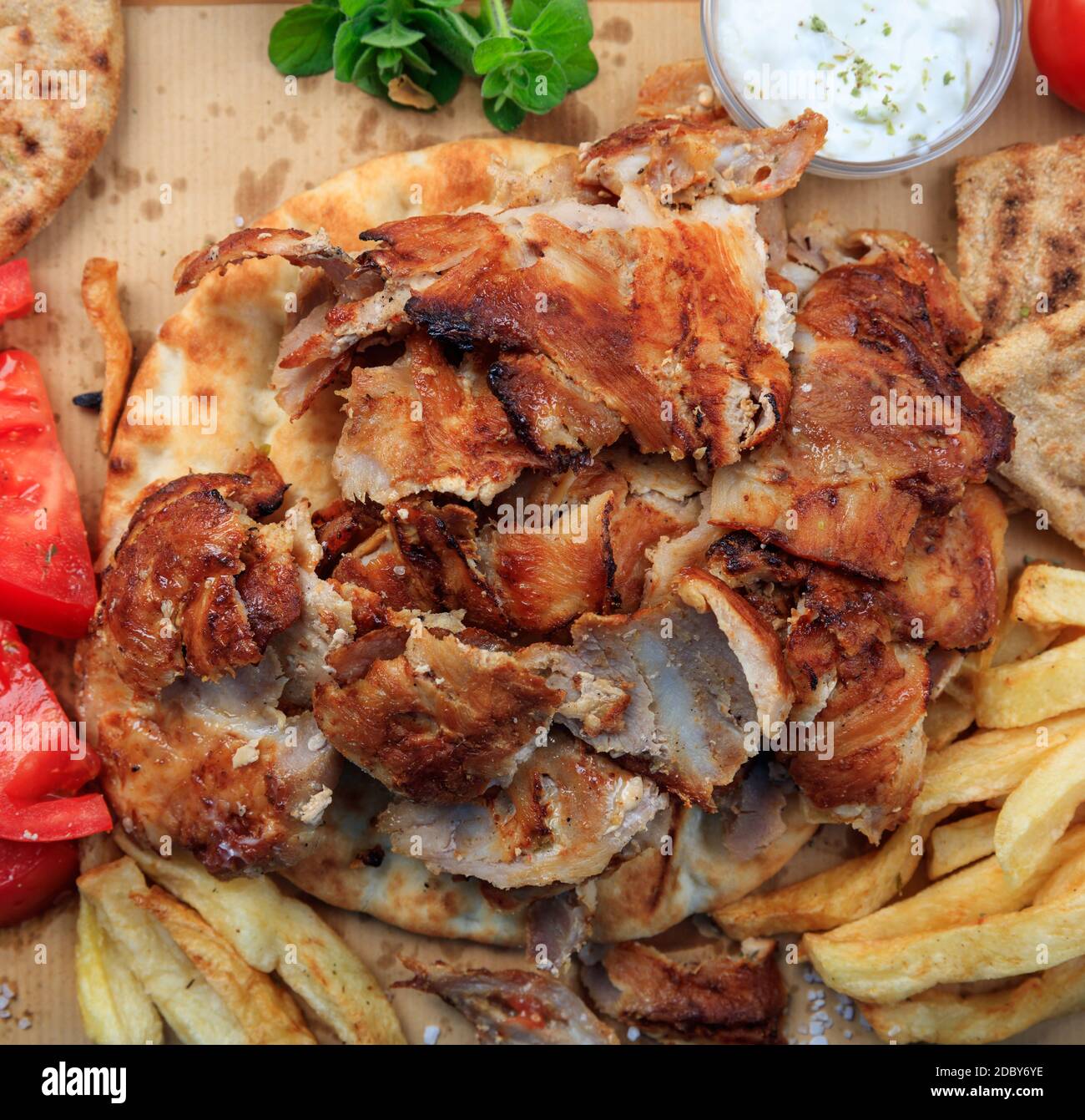 Gyros greek food. Grilled meat slices served with fried potatoes ...