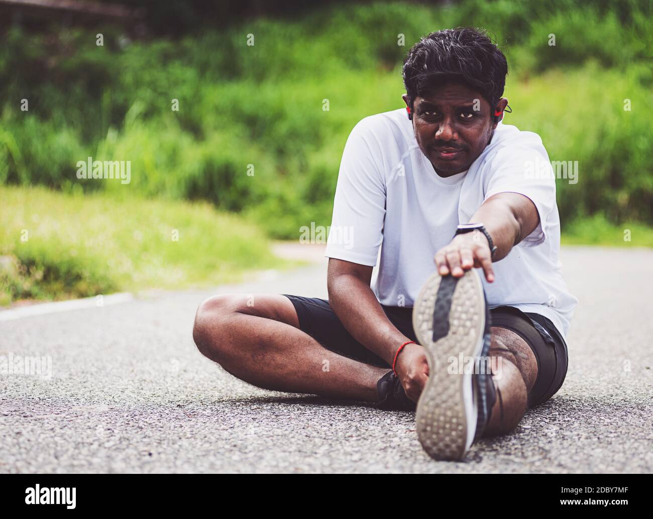 Close up Asian young athlete sport runner black man wear watch he ...