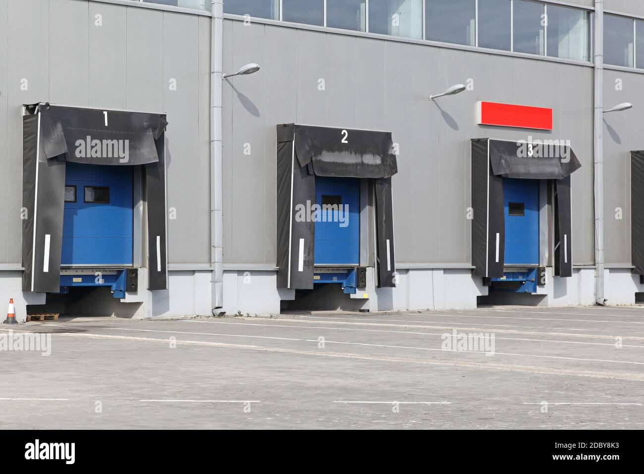 Loading Ramps Cargo Dock at Distribution Warehouse Stock Photo - Alamy