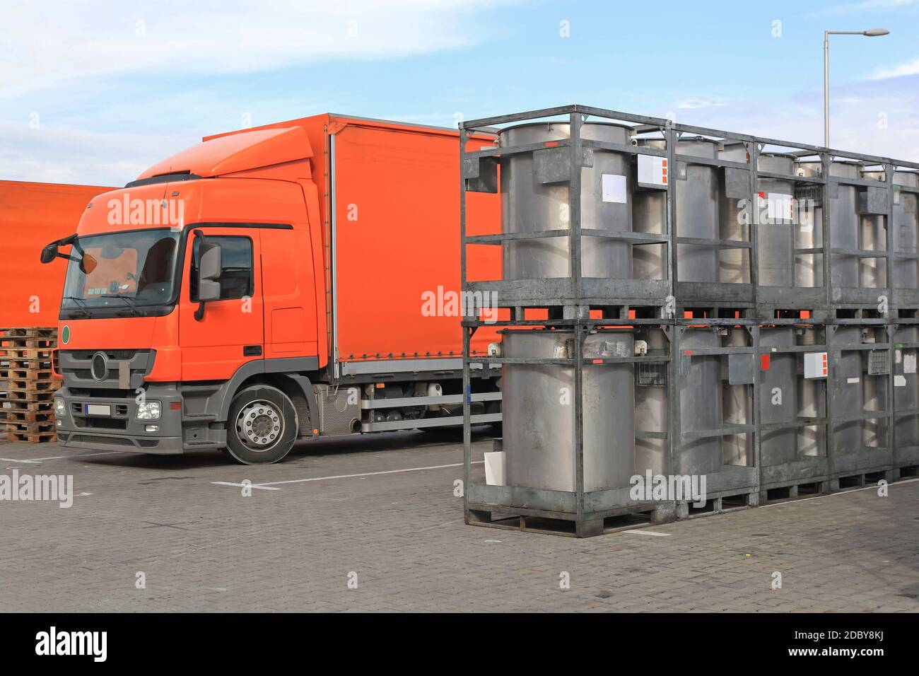 Metal Containers for Goods in Bulk Transport at Pallets Stock Photo - Alamy