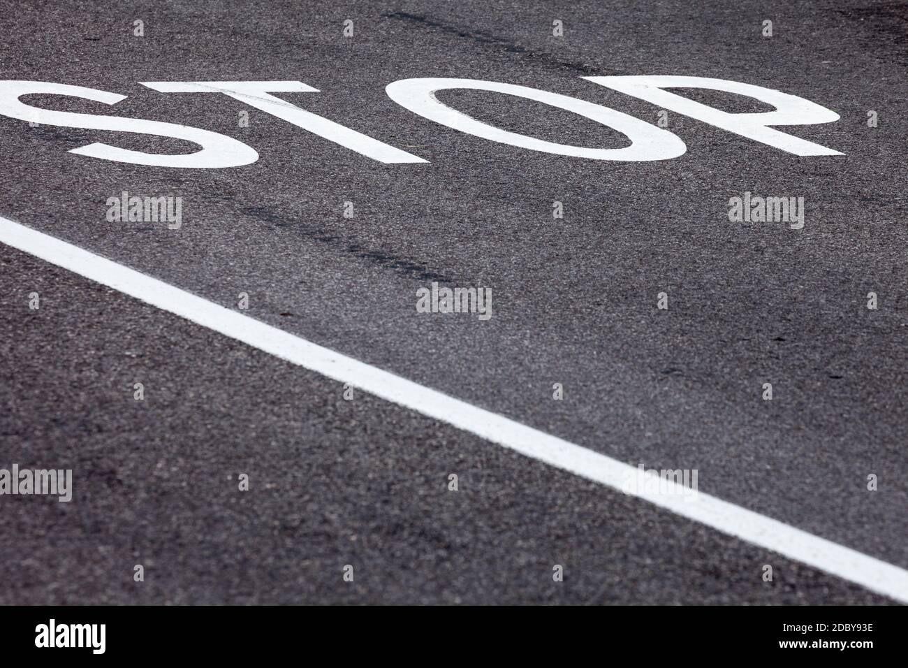 stop word over an asphalted street Stock Photo - Alamy