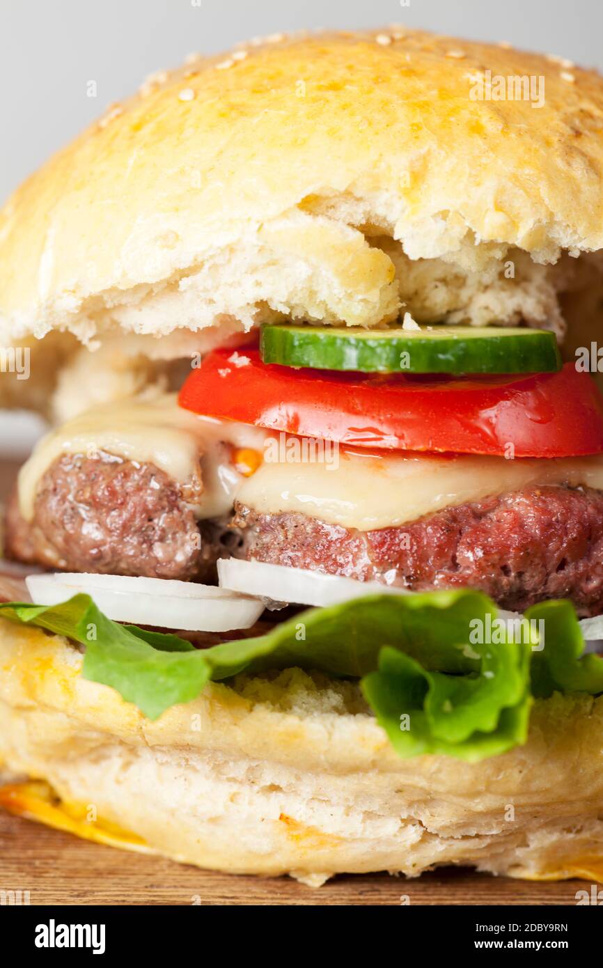 home made hamburger on rustic wood Stock Photo - Alamy