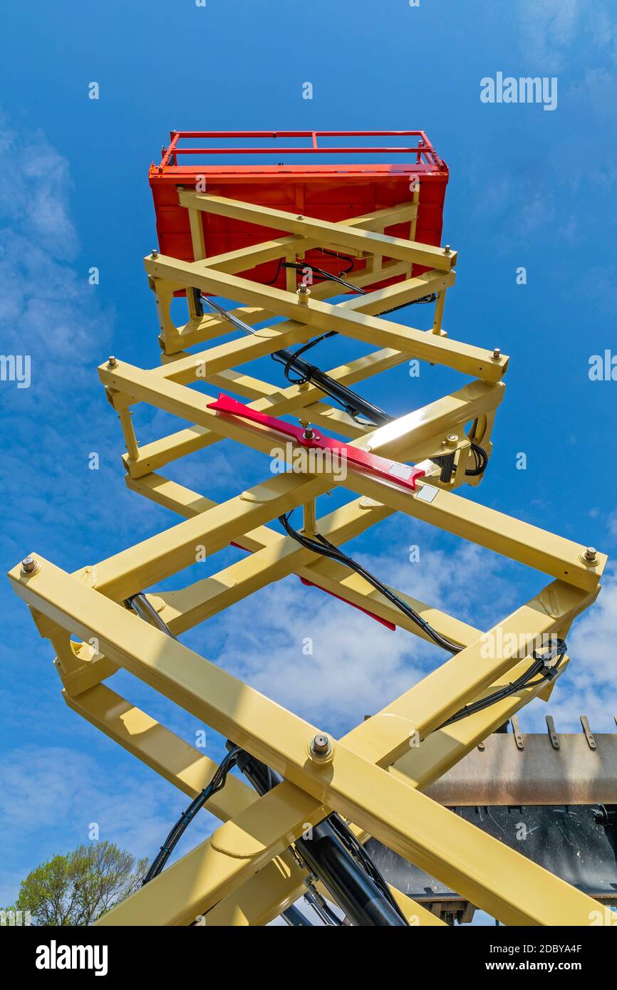Tall Scissor Lift Platform Machine at Construction Site Stock Photo - Alamy