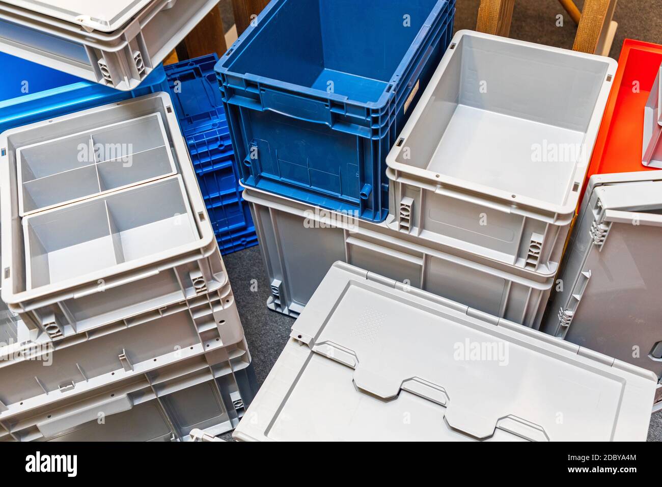Many Plastic Transport Boxes and Crates Stock Photo - Alamy