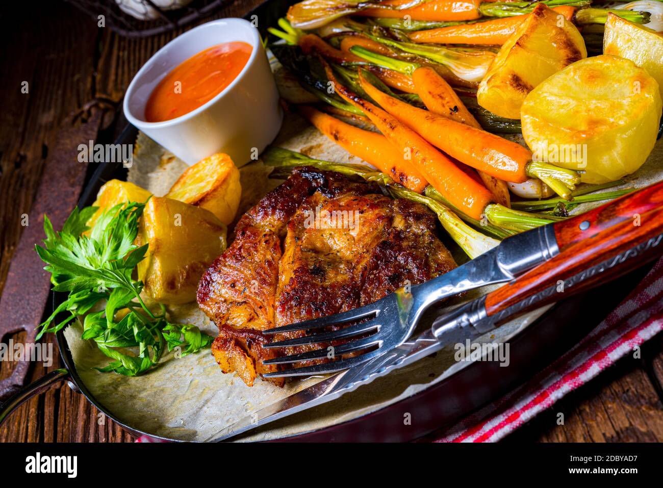 grilled neck chops with caramelized vegetables Stock Photo - Alamy