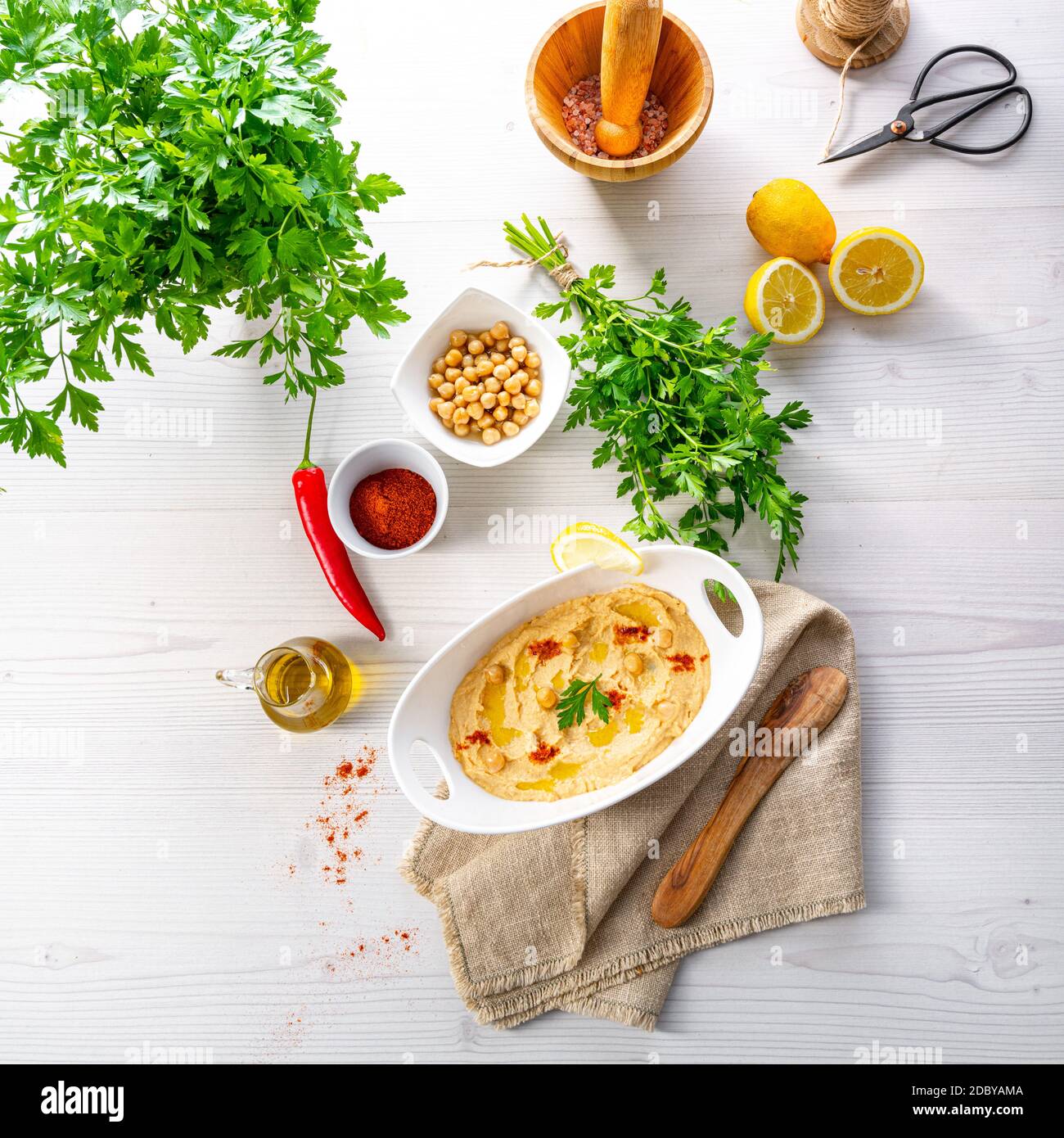 hummus paste with lemon and chilli on white background Stock Photo - Alamy