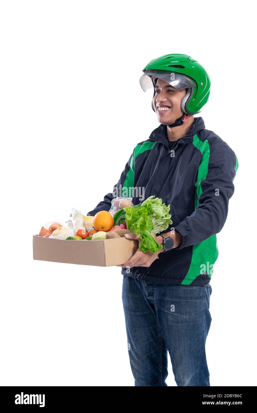 grocery delivery. courier wearing helmet and jacket uniform holding ...