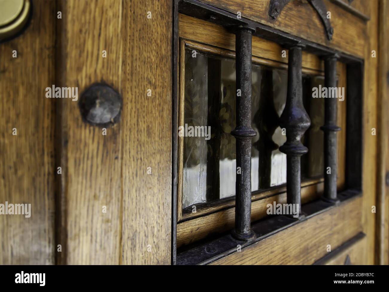 Old wooden door with glass, detail of decoration and abandonment ...