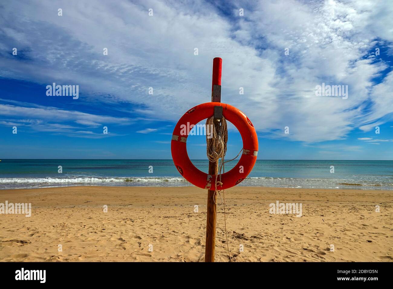 Red lifebelt wooden pole hi-res stock photography and images - Alamy