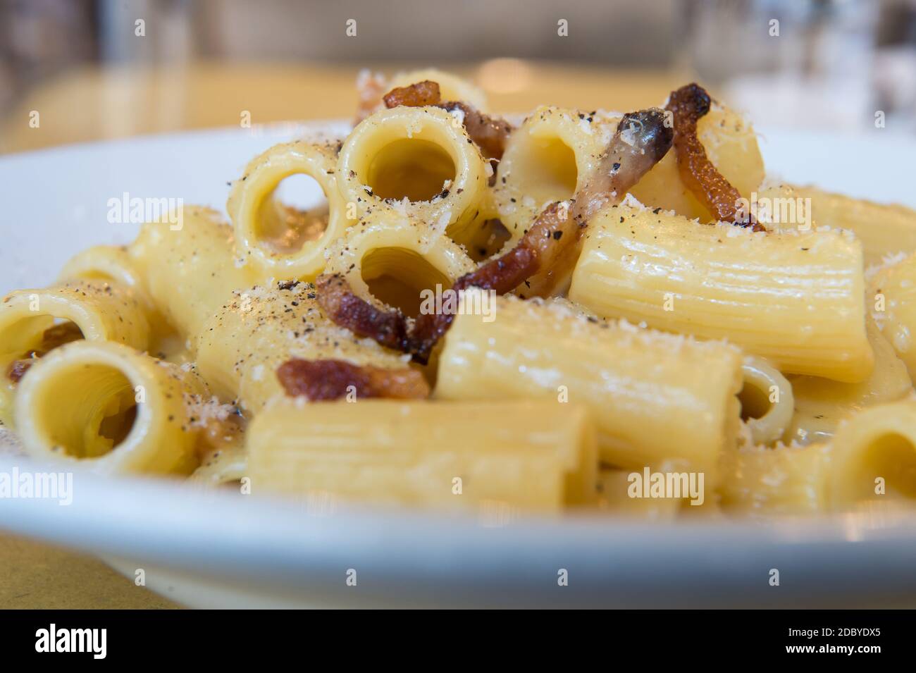 Rigatoni alla carbonara is a specialty dish from lazio region and Roma ...