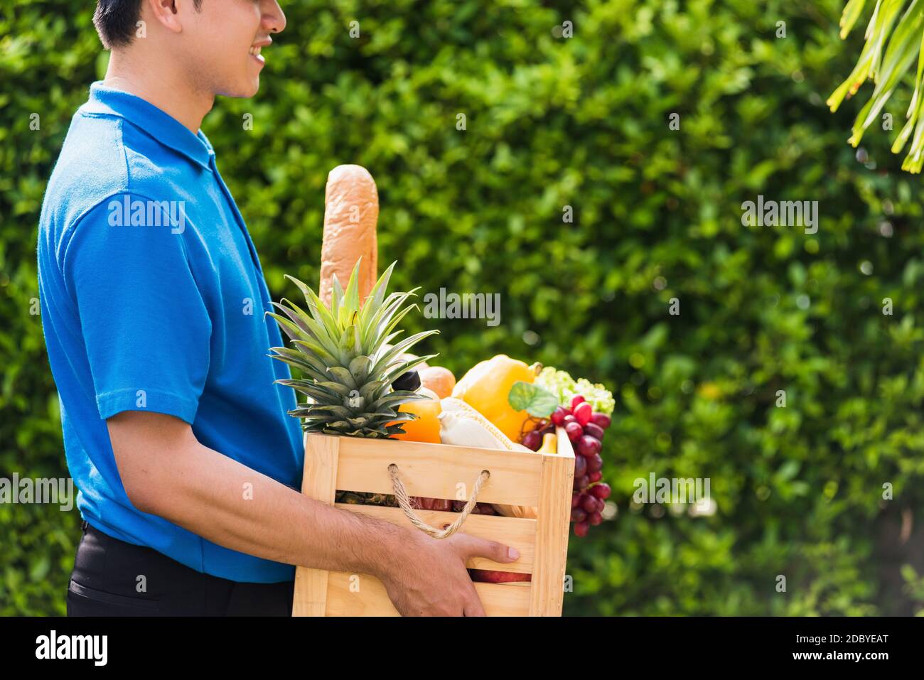 Asian man farmer wears delivery uniform he holding full fresh ...