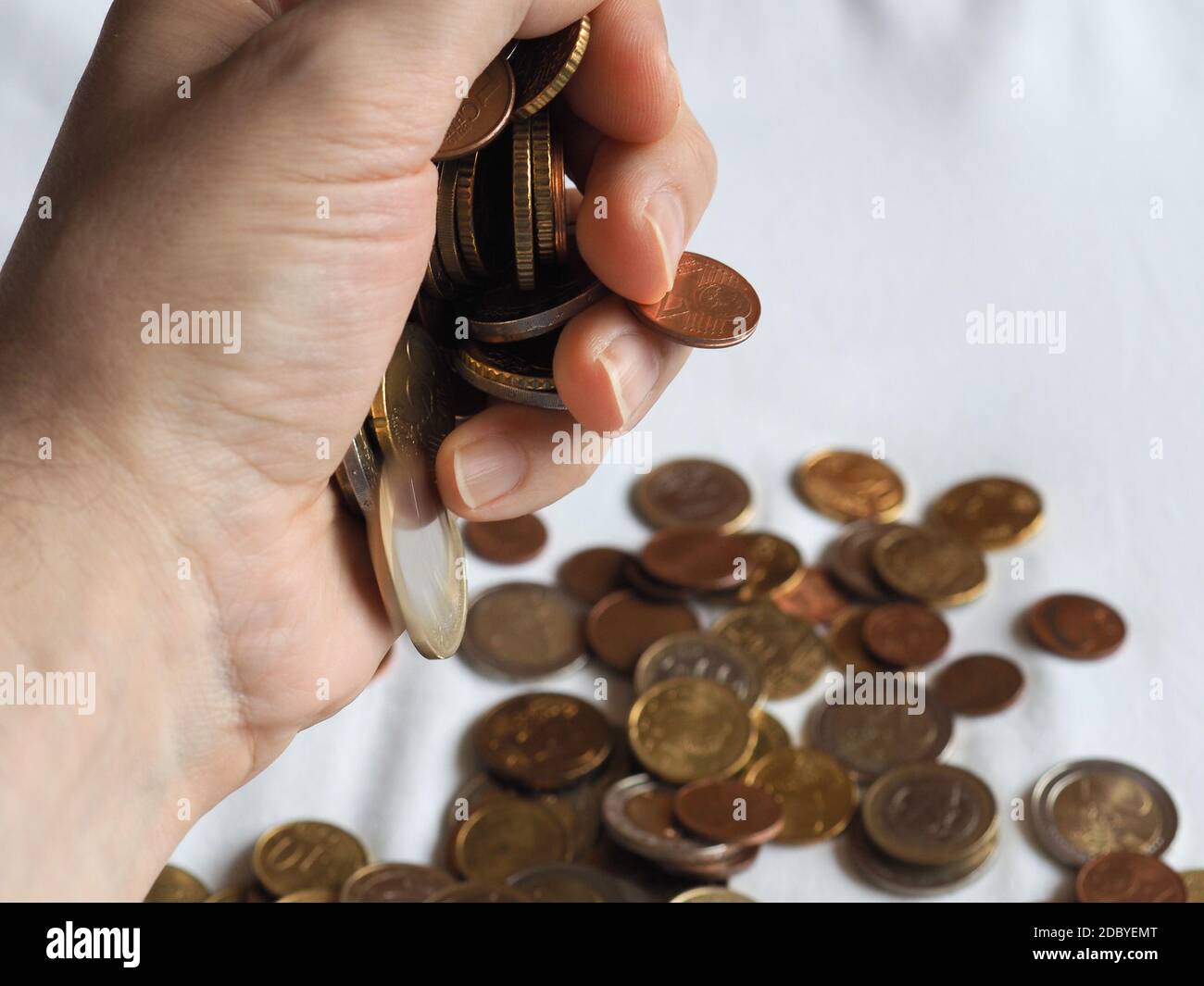 Hand handing Euro coins money (EUR), currency of European Union Stock ...