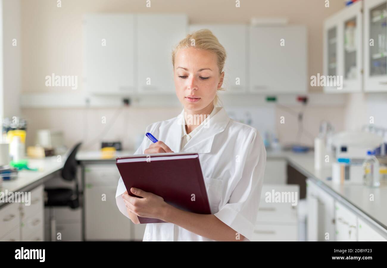 Female pharmacist taking inventory hi-res stock photography and images ...