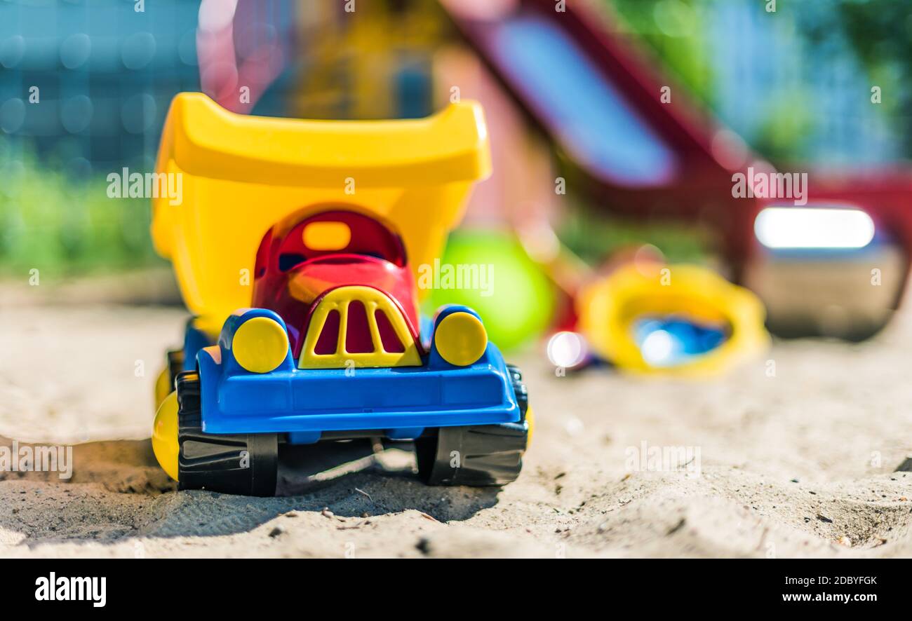 Colorful plastic children toys on the playground Stock Photo - Alamy