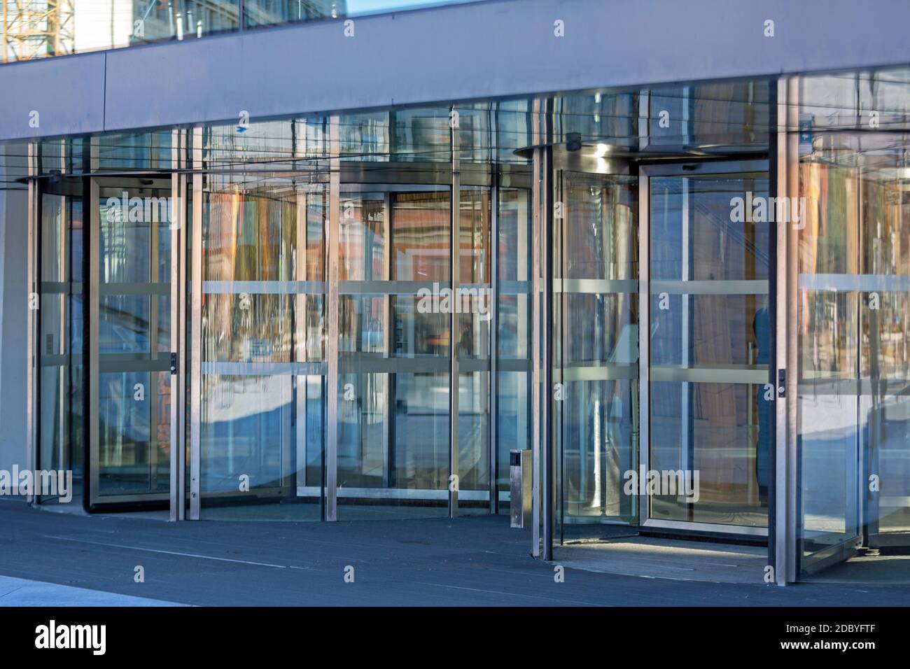 Automatic Revolving Doors at Modern Building Entrance Stock Photo - Alamy