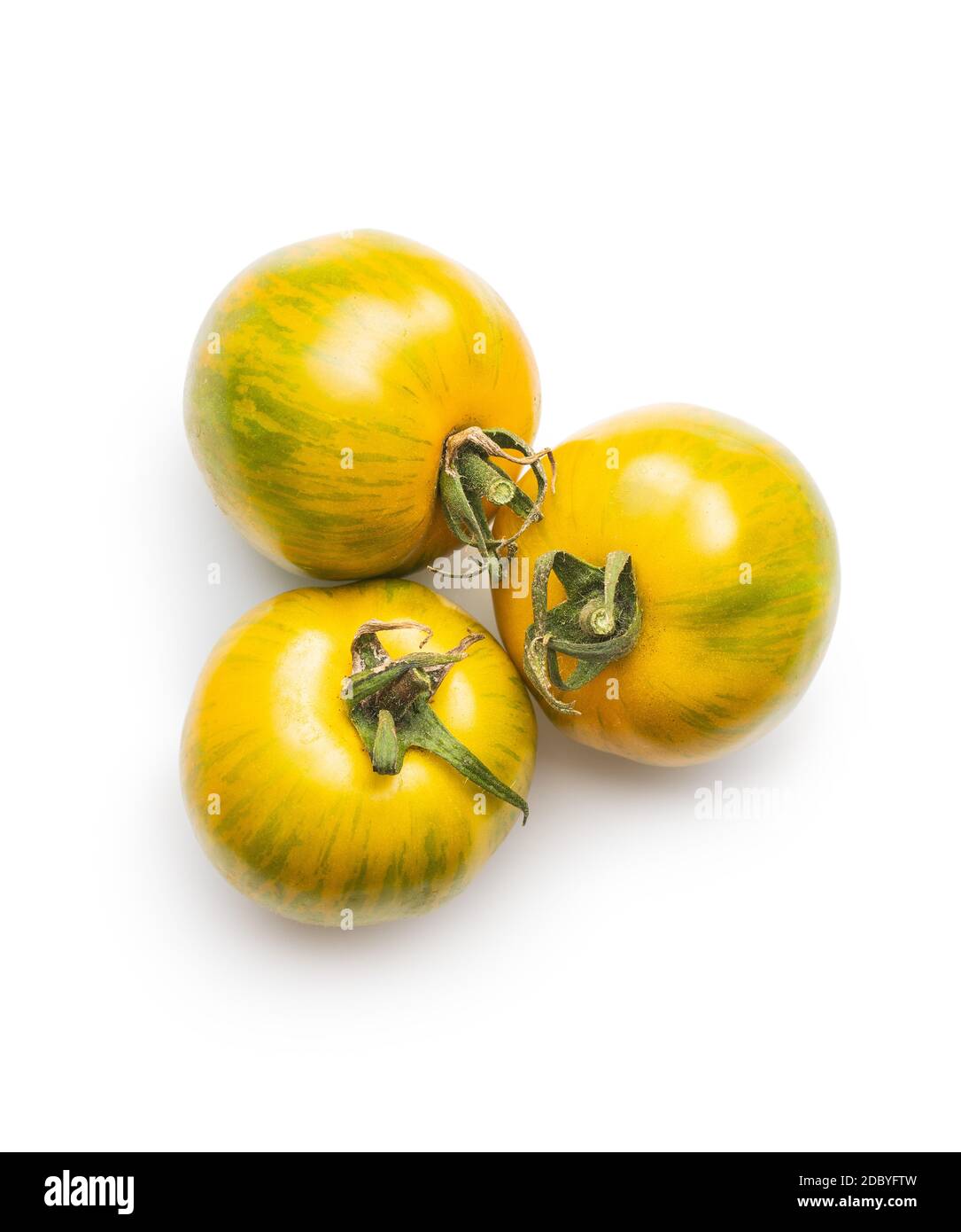 Green zebra tomatoes isolated on white background Stock Photo - Alamy