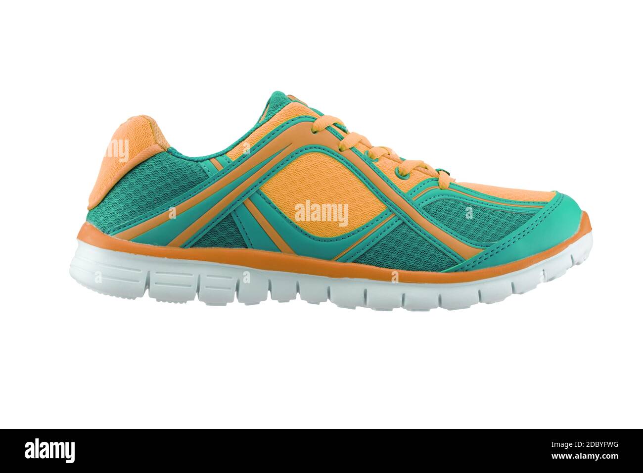 A side view of a green and gold training shoe on white background Stock ...